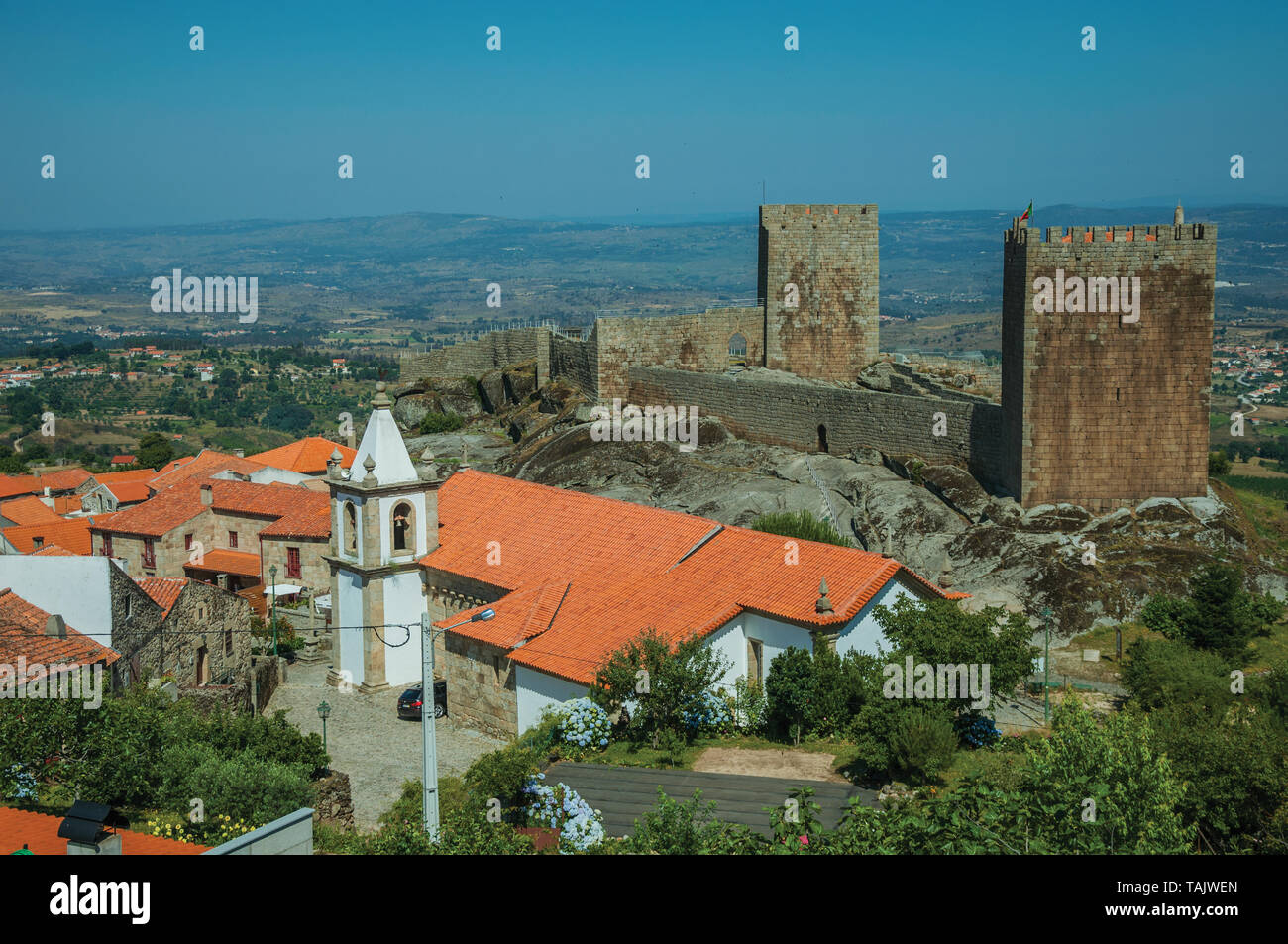 Roofs and baroque steeple beside walls and towers from Castle at ...