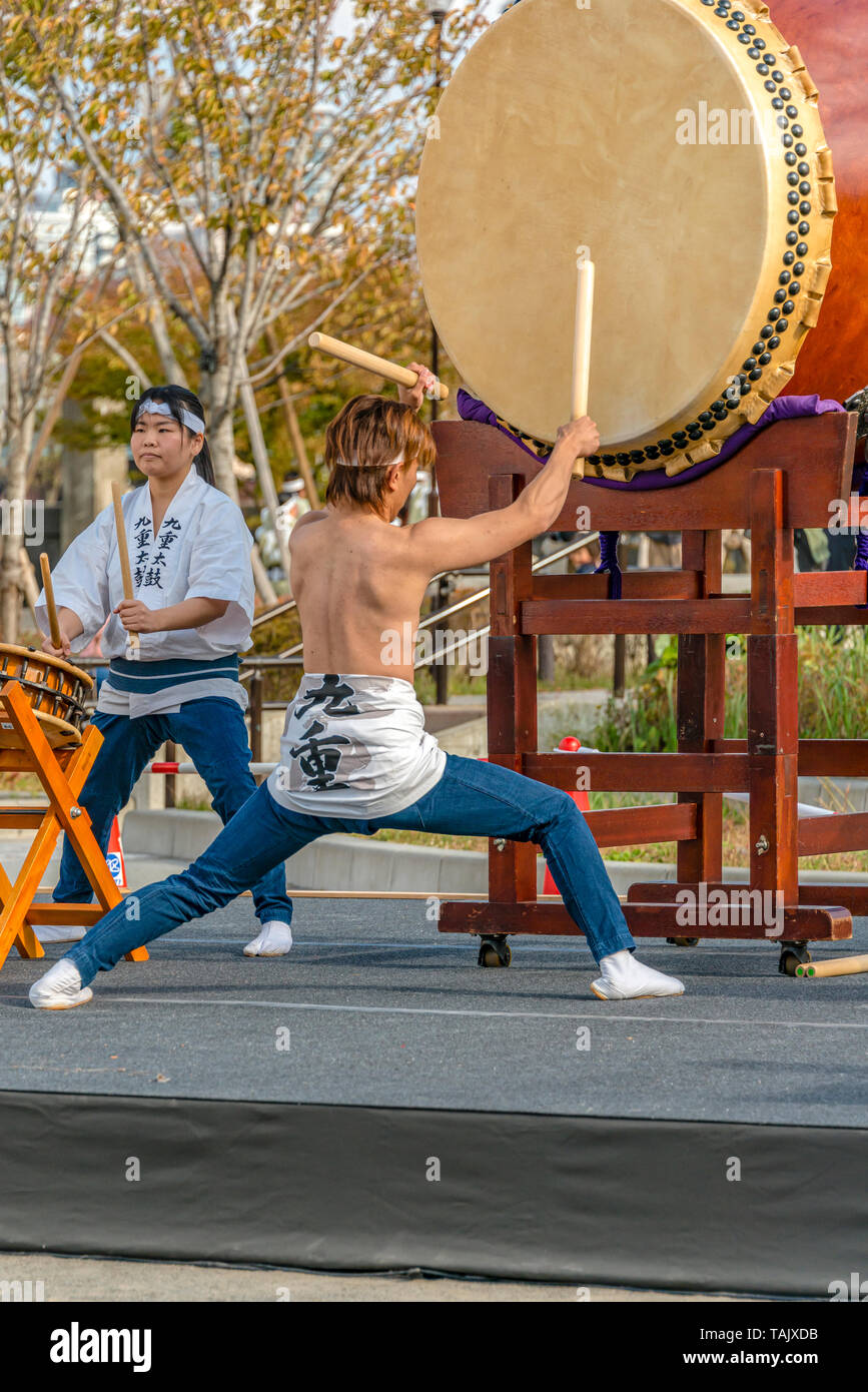 Traditional Taiko drummer performing at a local competition in Tokyo ...