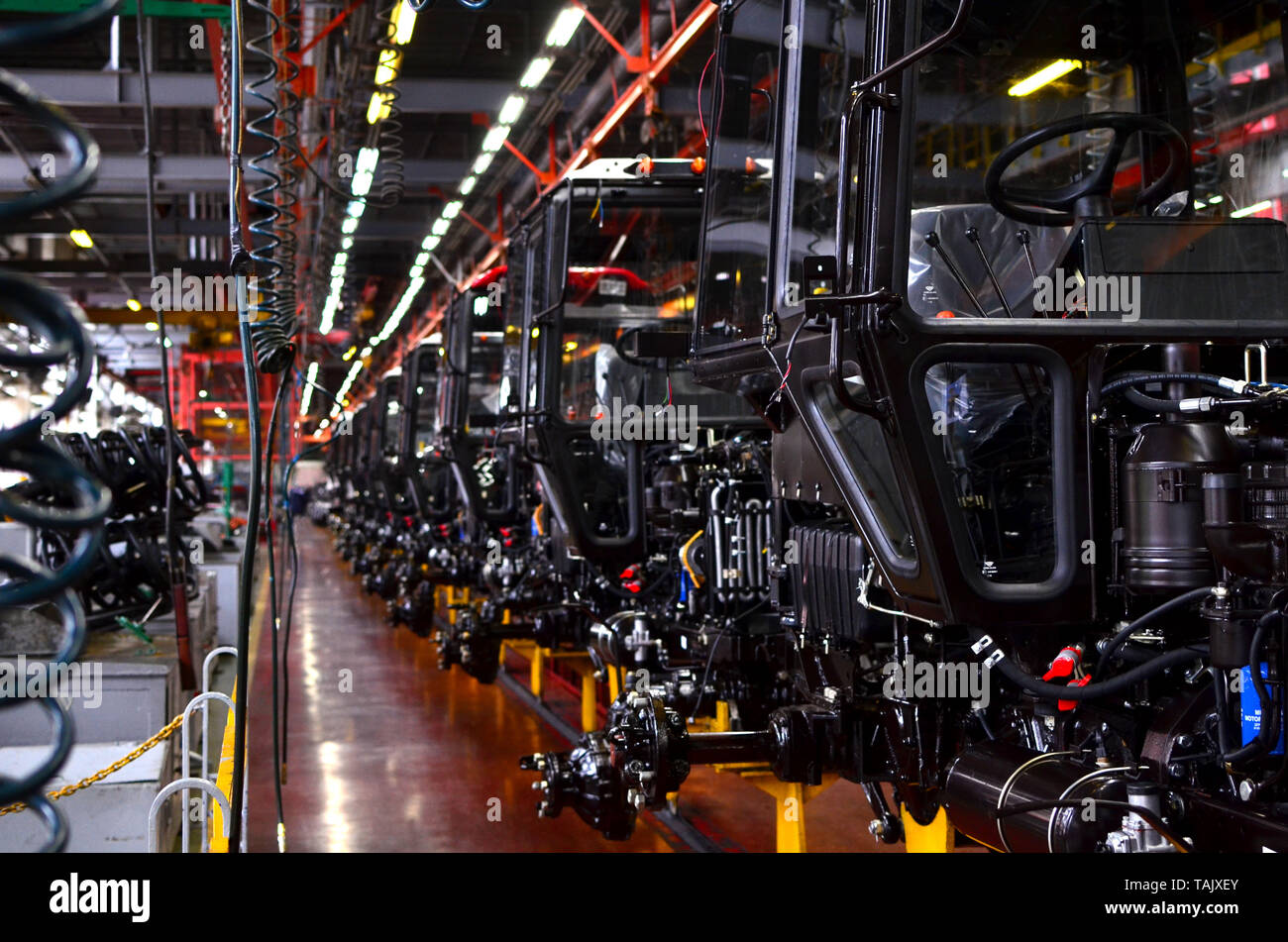 Tractor Manufacture work. Assembly line inside the agricultural ...