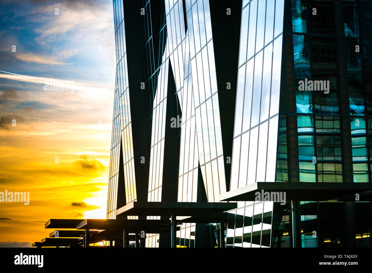Abstract and modern skyscraper front at sunset Stock Photo - Alamy