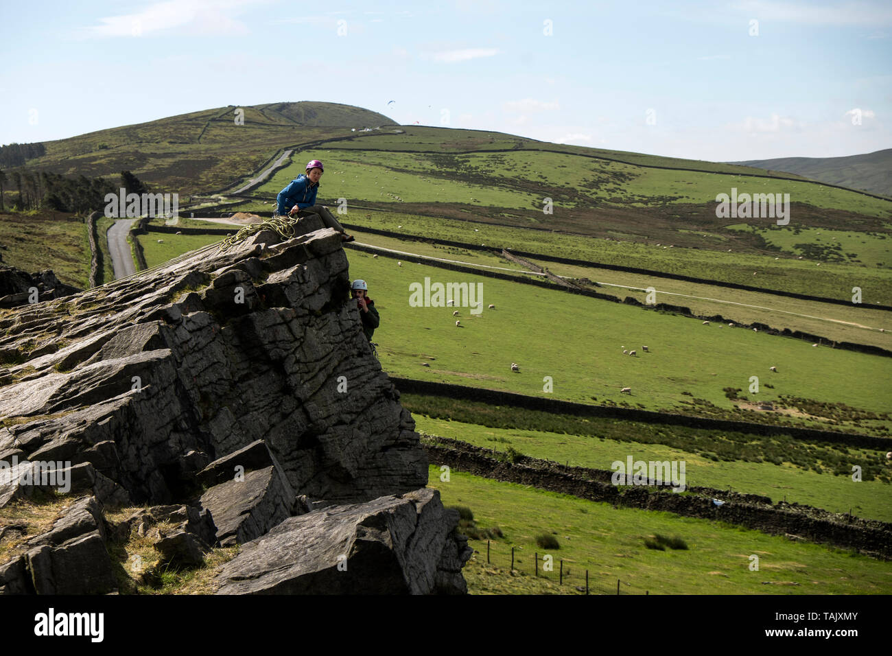 Rock climbers at Windgather Rocks in the Peak District National Park ...