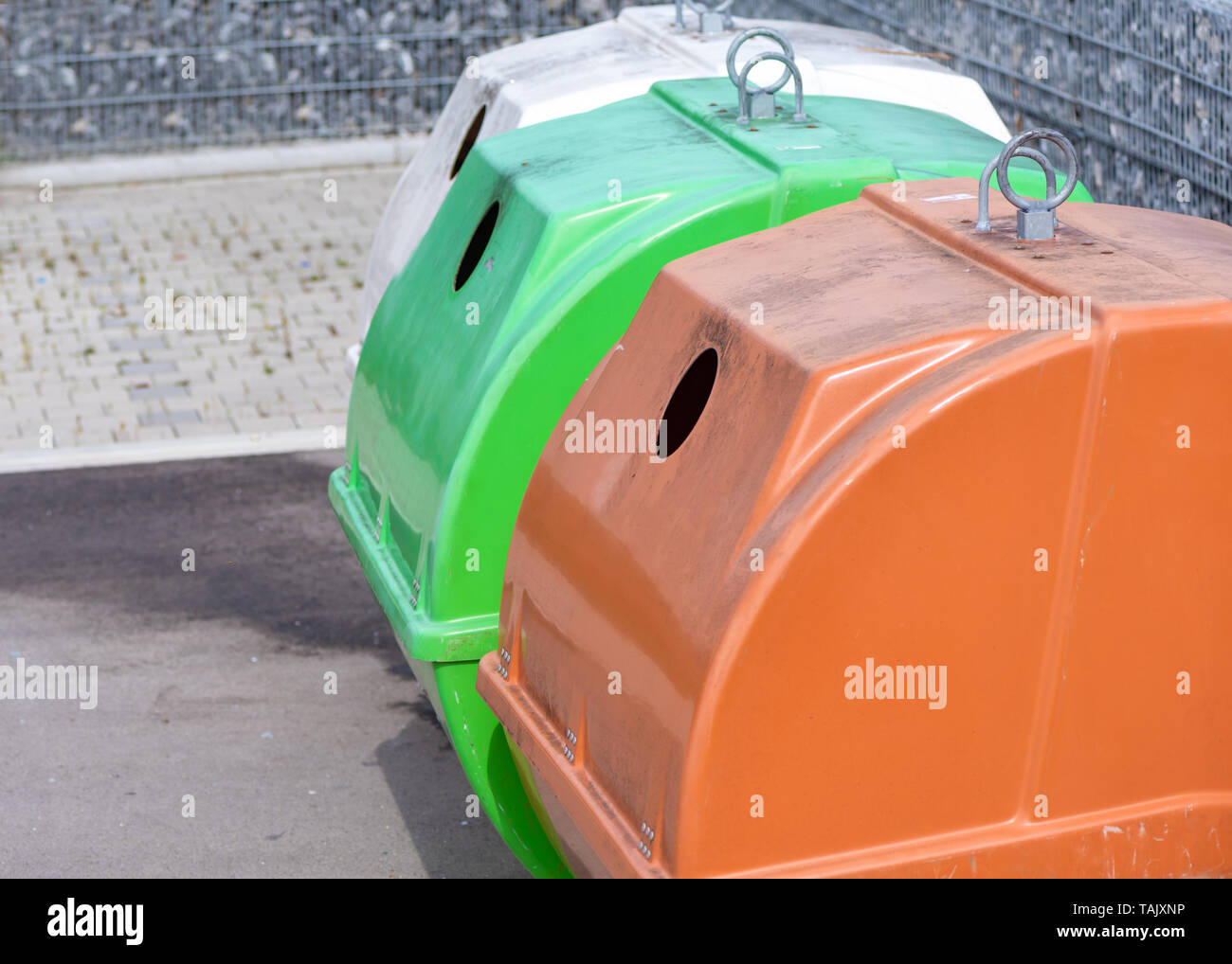 Three big Containers in different colors to collect recyclable waste ...