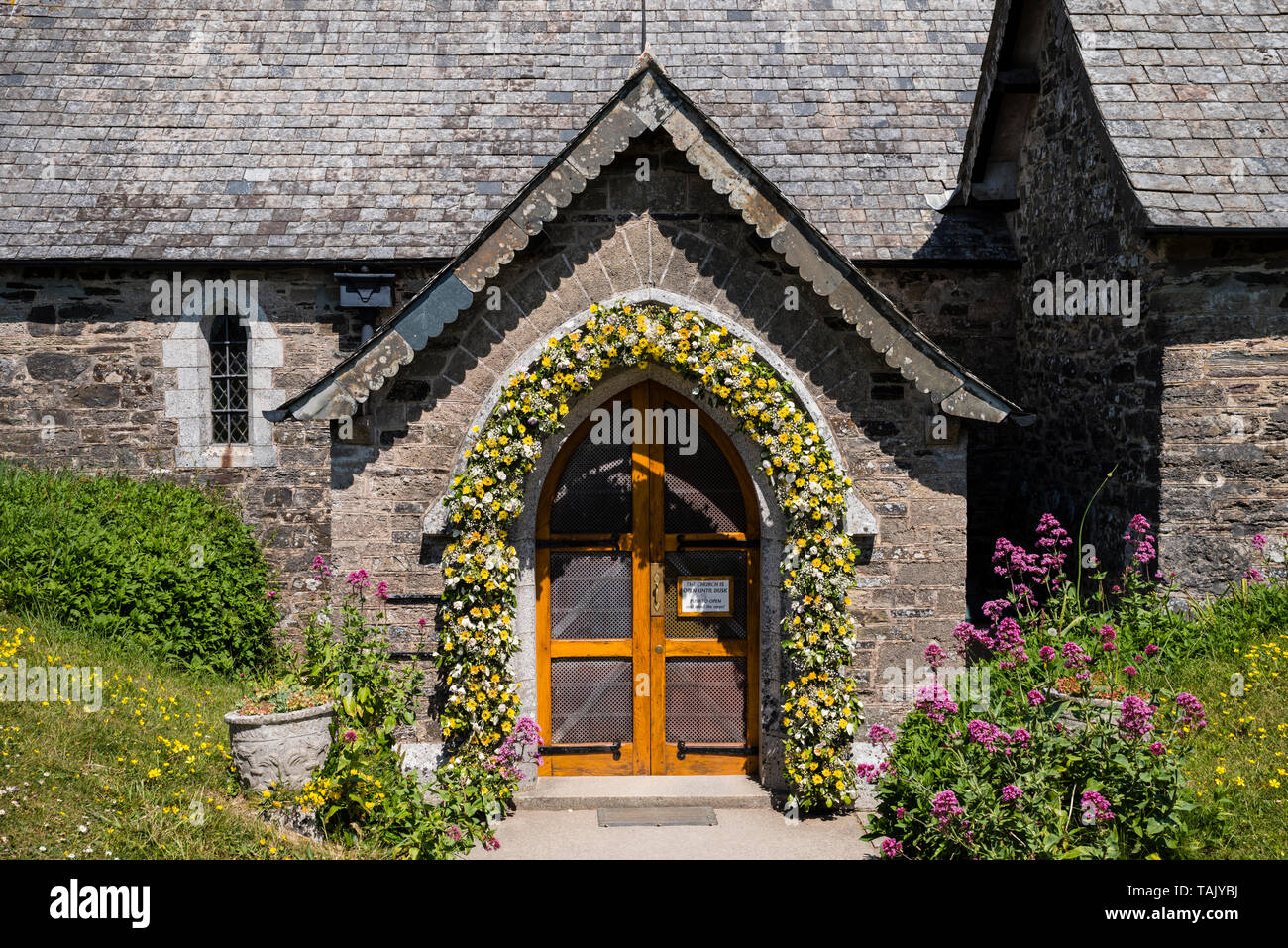 Entrance doorway to St. Enodoc's Church with an archway formed of ...