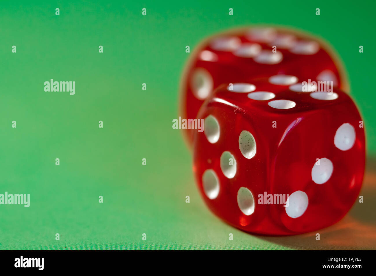 Closeup of a two red dice with a winning number on the top face on a ...