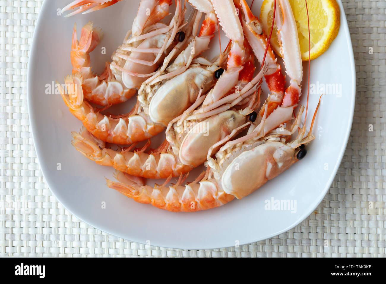 Raw scampi, ingredients ready to be cooked. Four scampi in the dish ...
