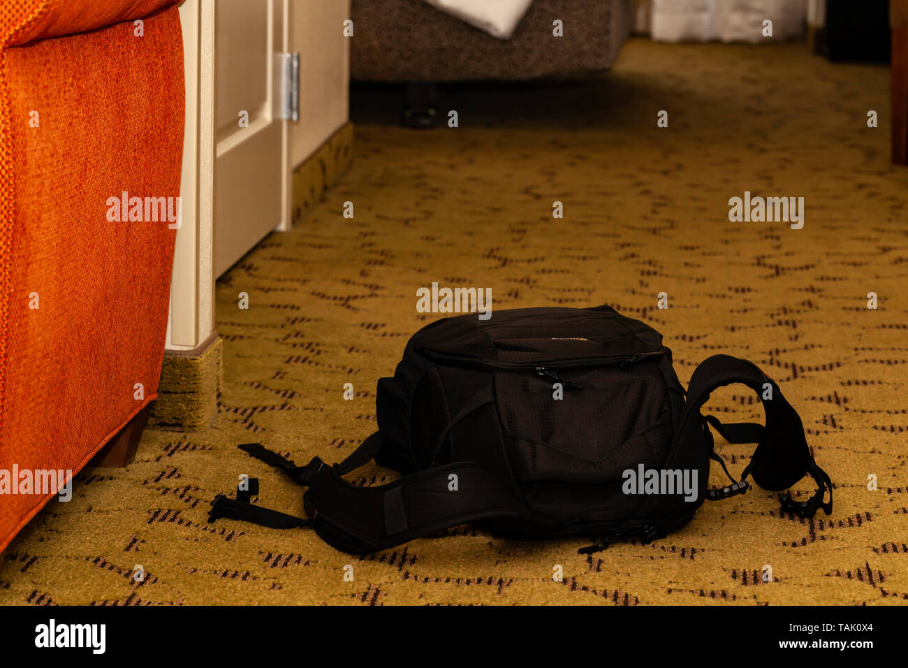 A forgotten bag laying on the floor of a hotel room, sure to cause ...