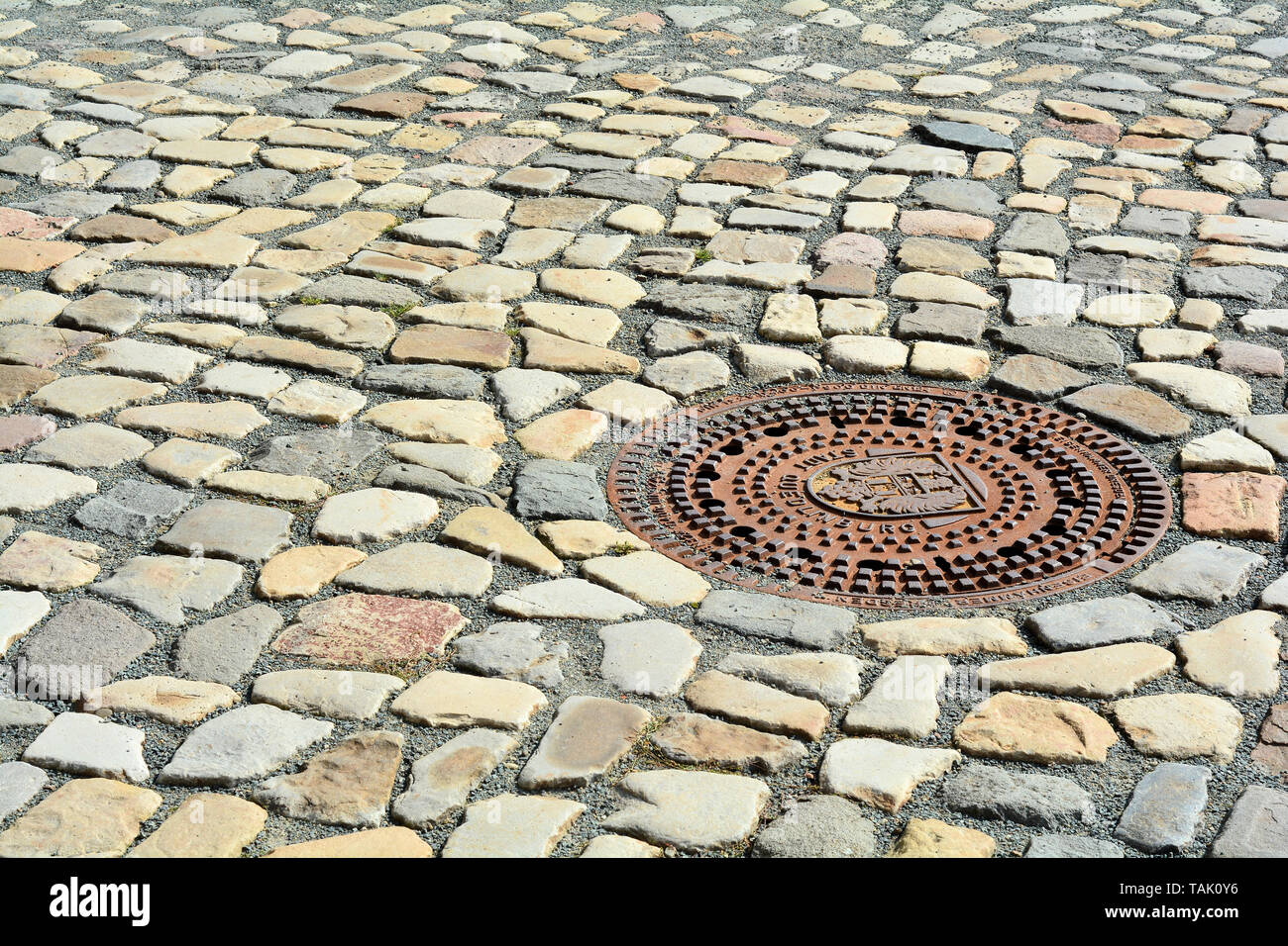 Manhole cover paving hi-res stock photography and images - Alamy