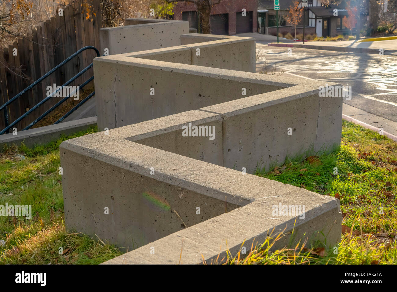Concrete blocks on a grassy terrain at the side of a road in Salt Lake ...