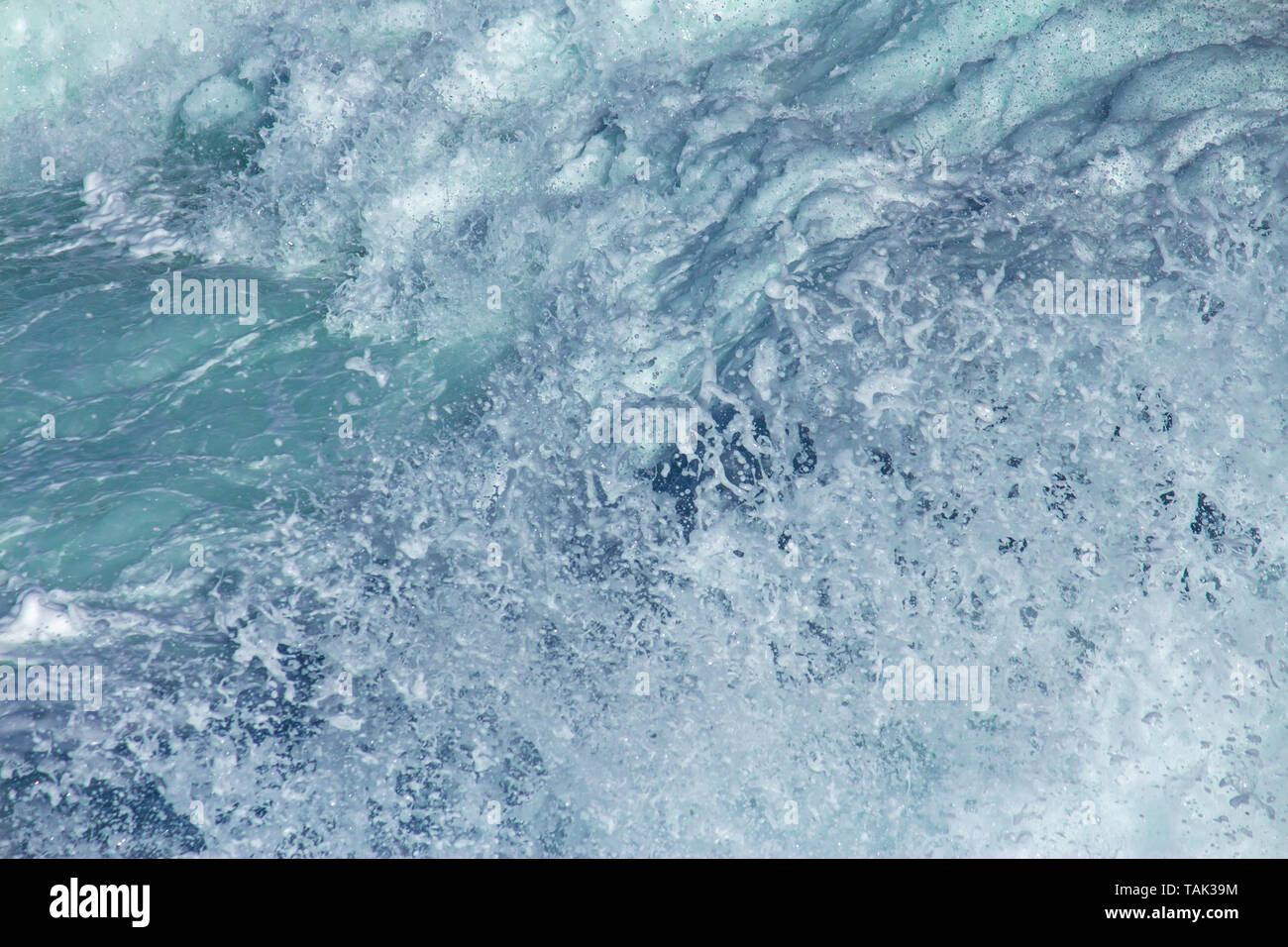 Aquatic background of sea surf waves close up with clear water and ...