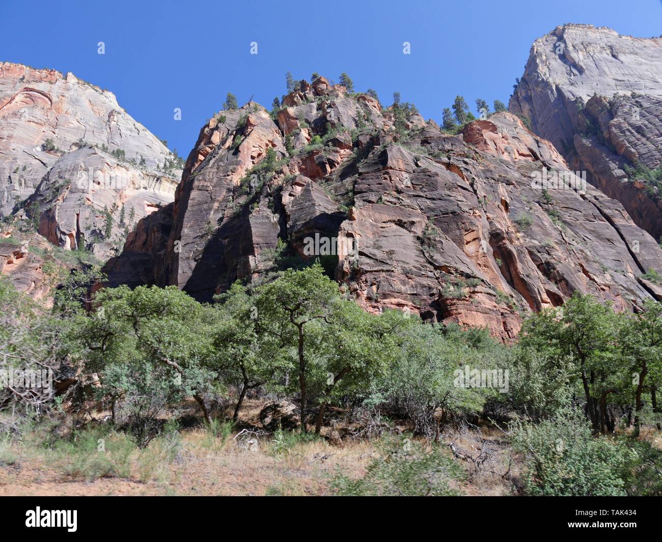 Imposing rocks and steep sandstone cliffs with sharp edges and peaks at ...