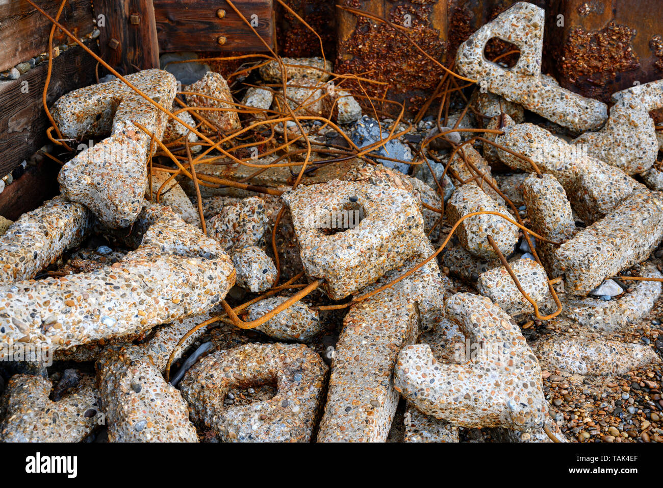 Concrete groynes effected by coastal erosion Stock Photo - Alamy