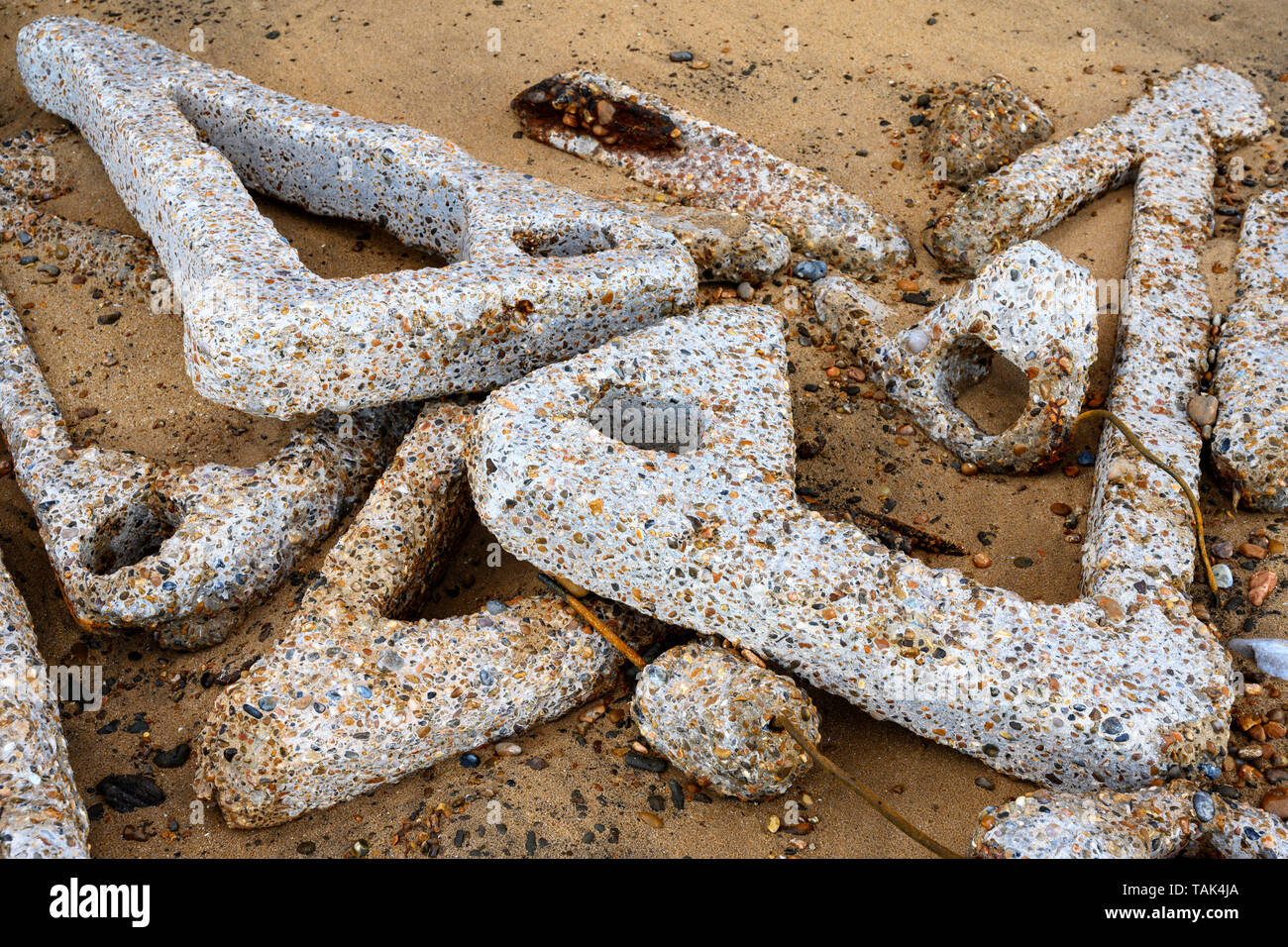 Concrete groynes effected by coastal erosion Stock Photo - Alamy