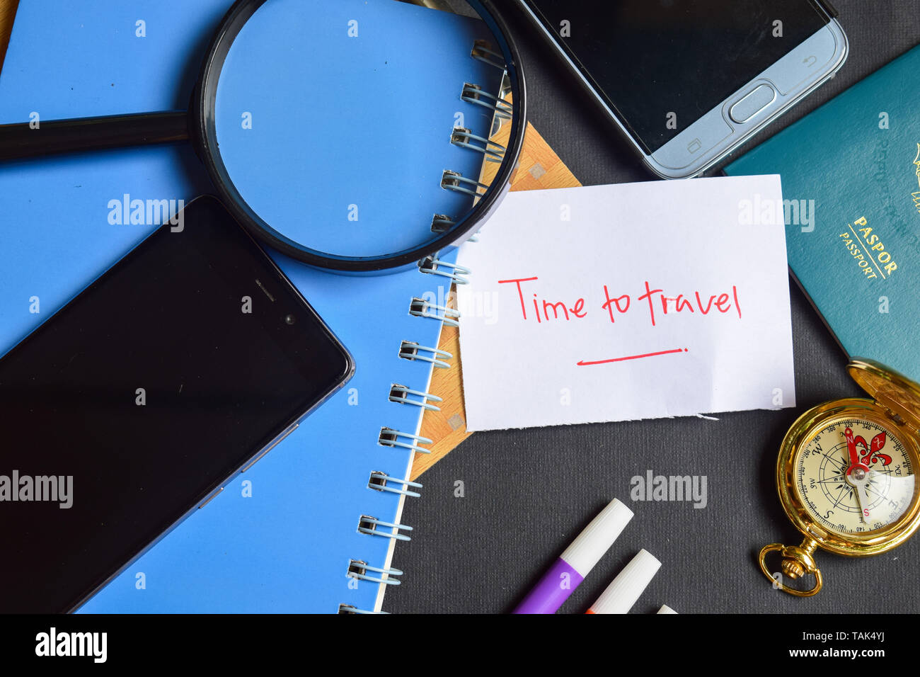 Time to Travel written on paper. passport, magnifying glass, Compass ...