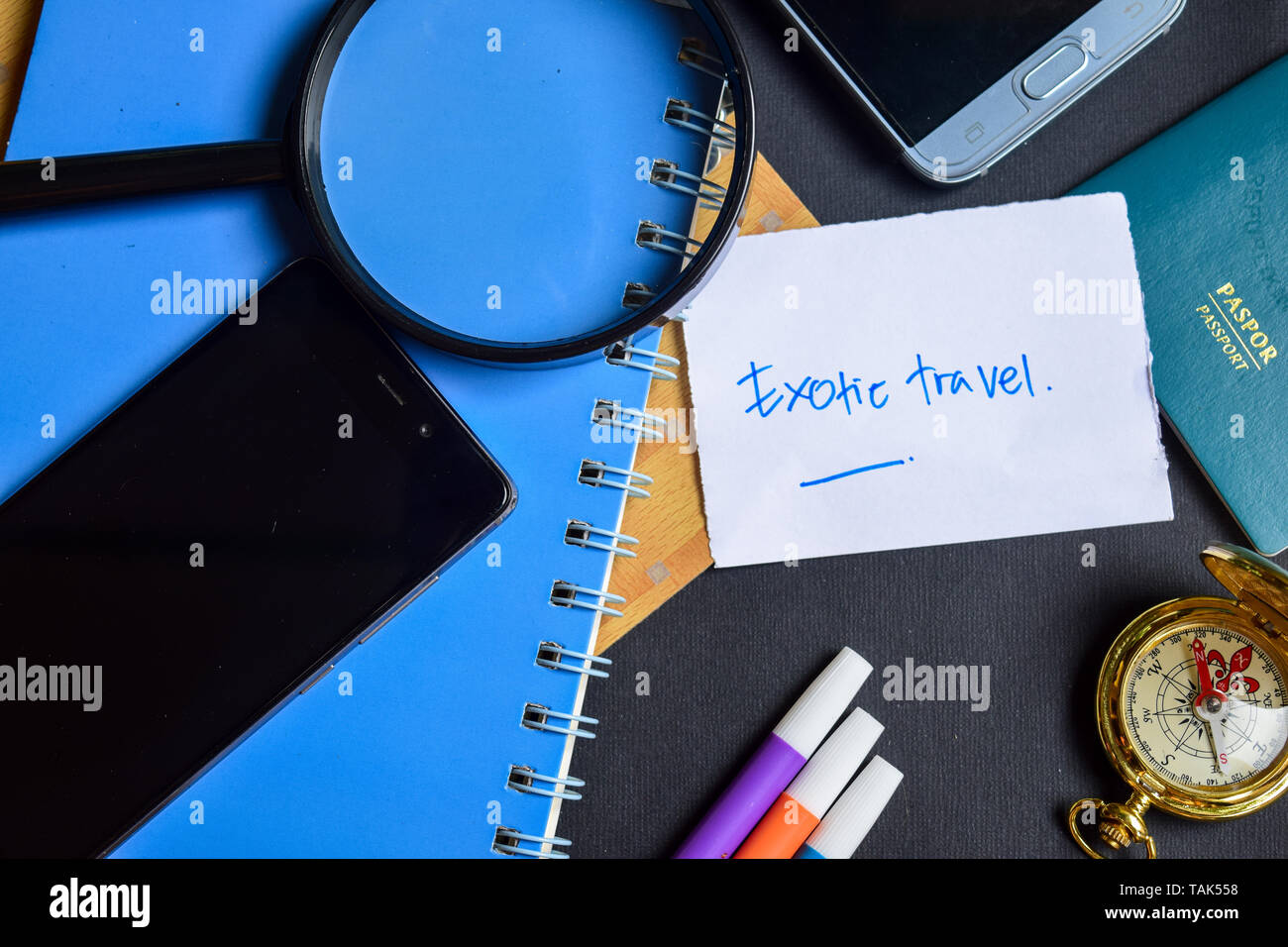 Exotic Travel on paper. passport, magnifying glass, Compass, Smartphone ...