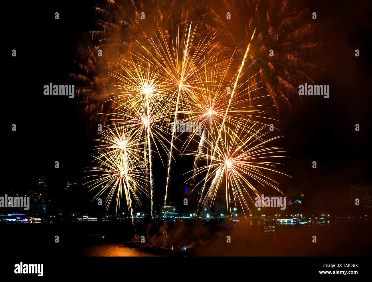 Stunning gold color fireworks exploding in to the night sky over ...
