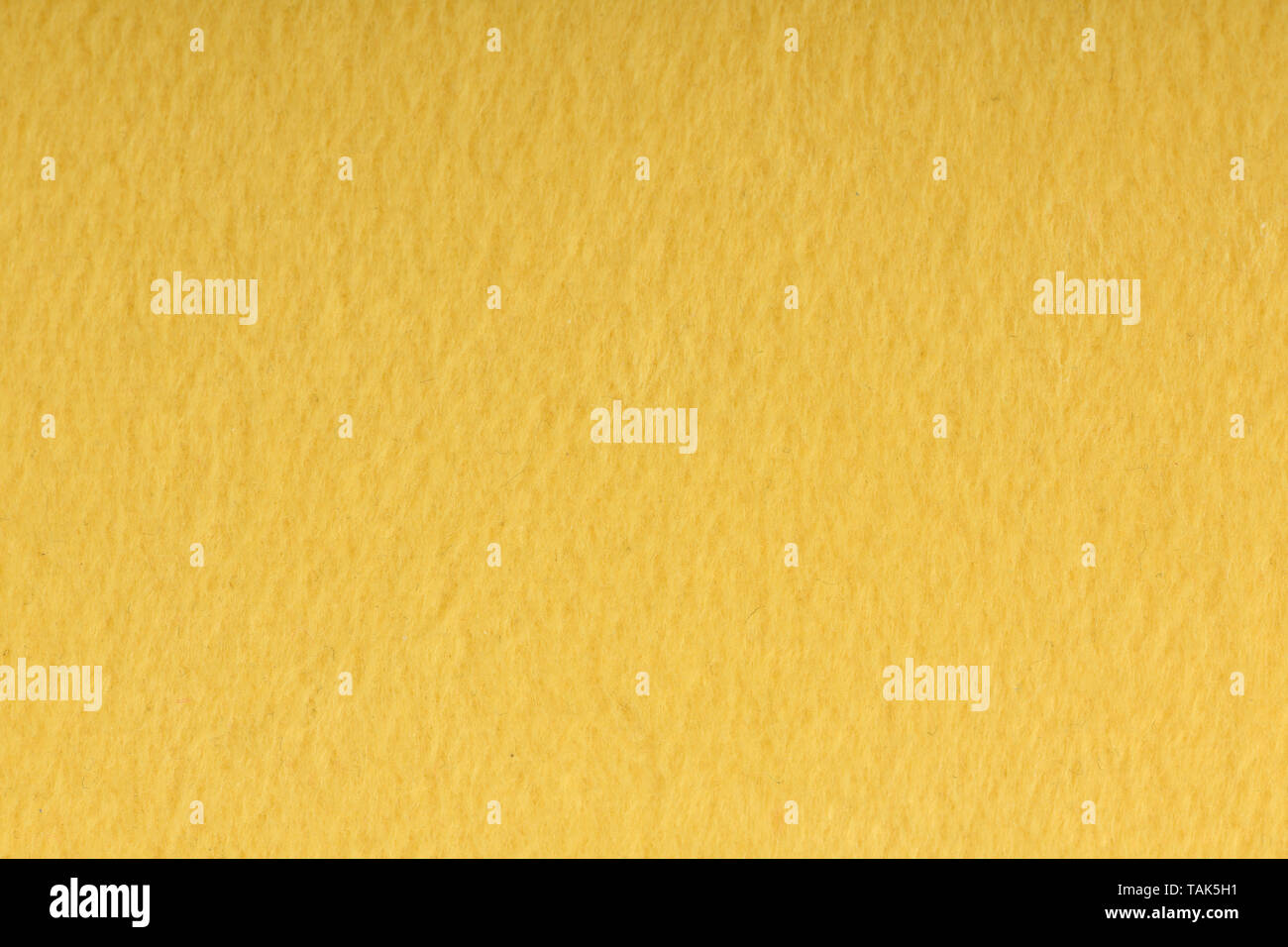 Texture of light yellow wool textile material closeup. Green abstract ...