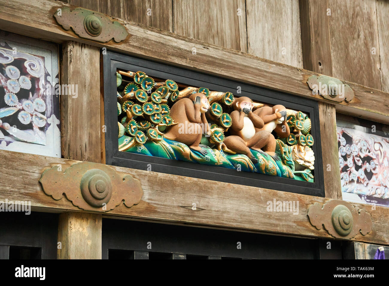 A replica of the famous three wise monkeys wooden carving panel sits ...