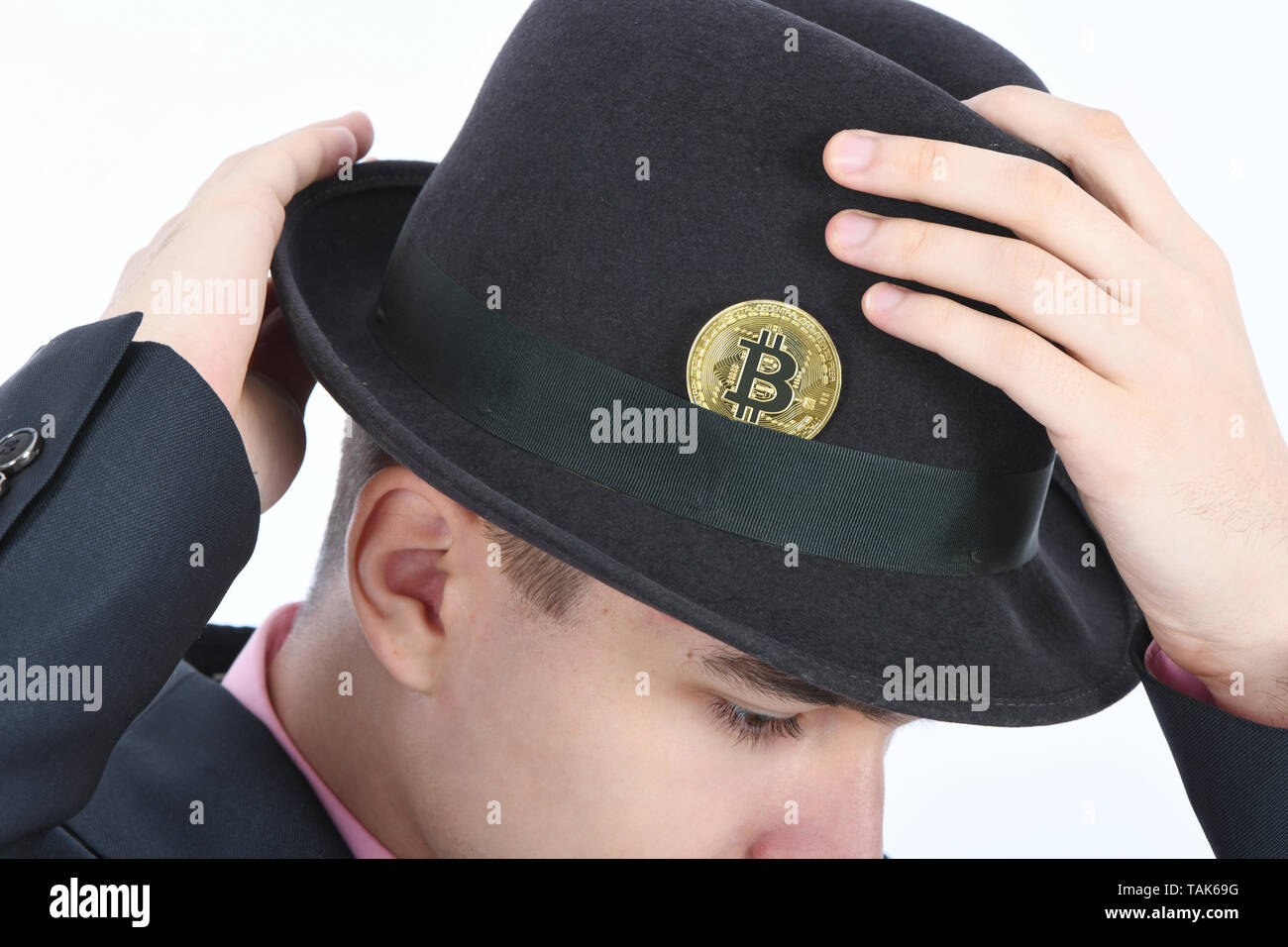 Bitcoin in a felt men's hat isolated on white background. High ...