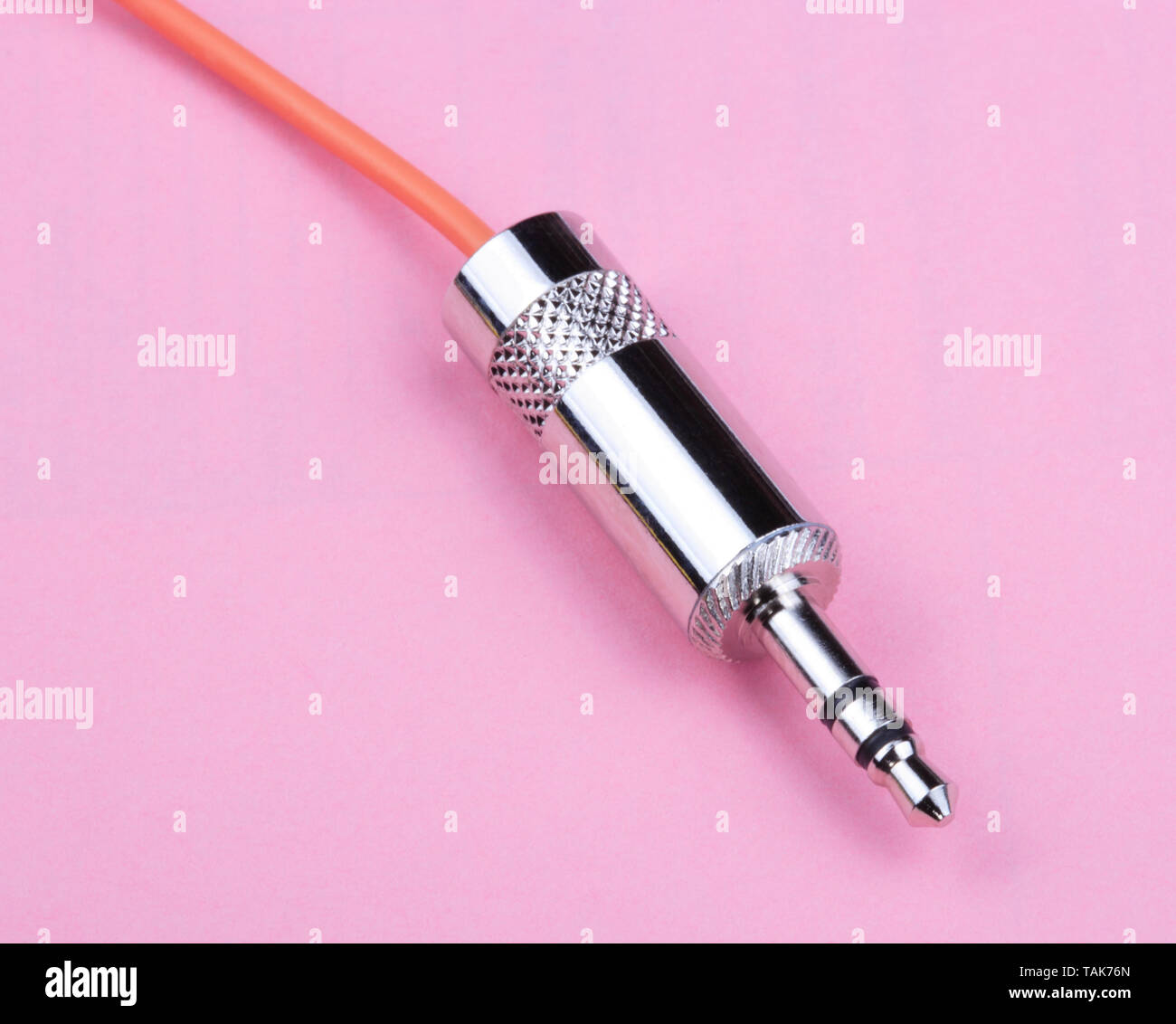 Stereo Male Plug Connector on Pink Background Stock Photo - Alamy