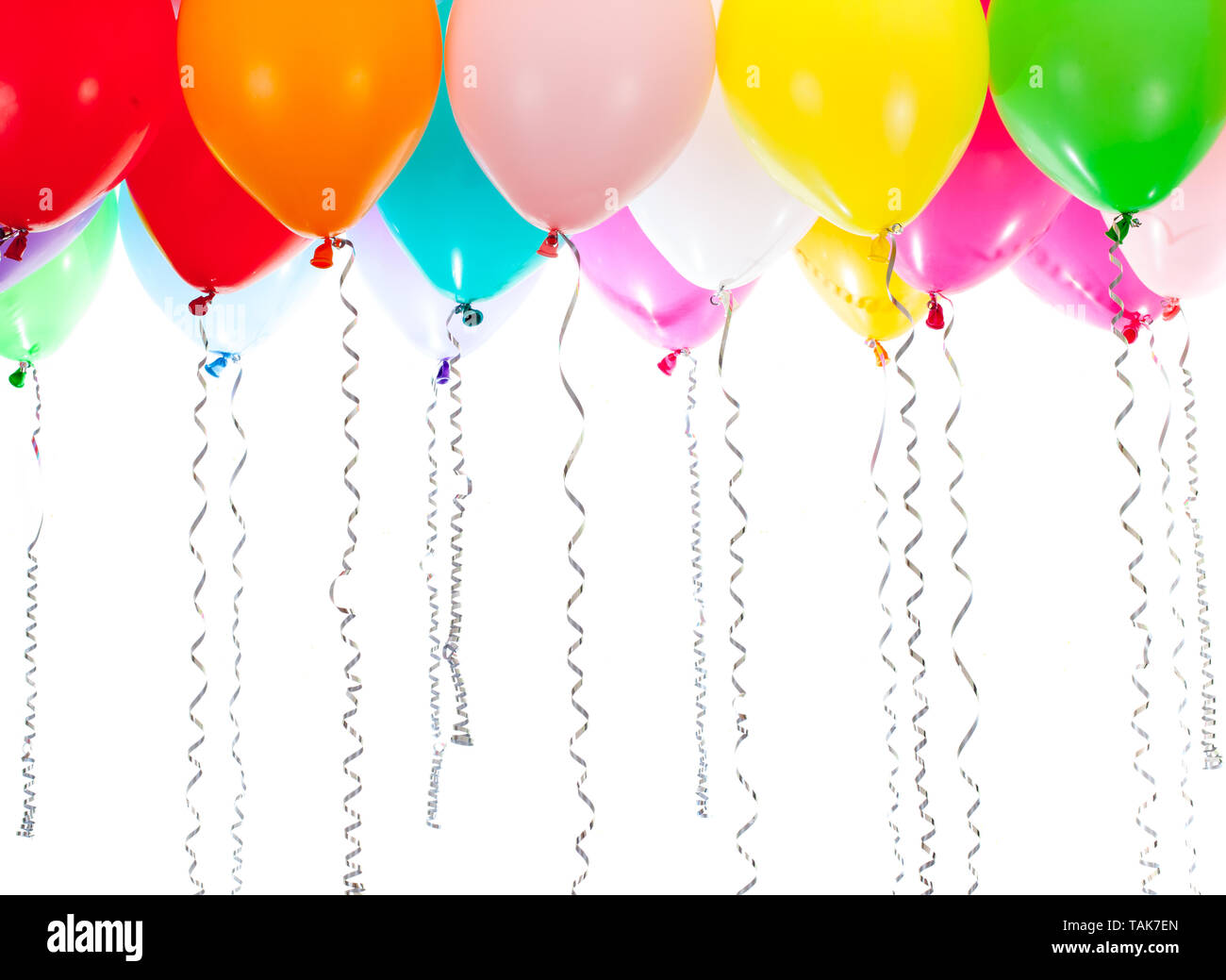 colorful balloons helium filled on white background Stock Photo - Alamy