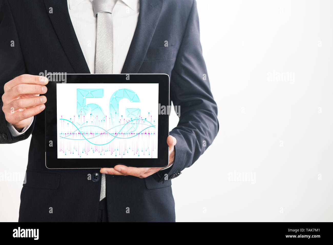 5g tablet on businessman hand connect worldwide. 5G network connection ...