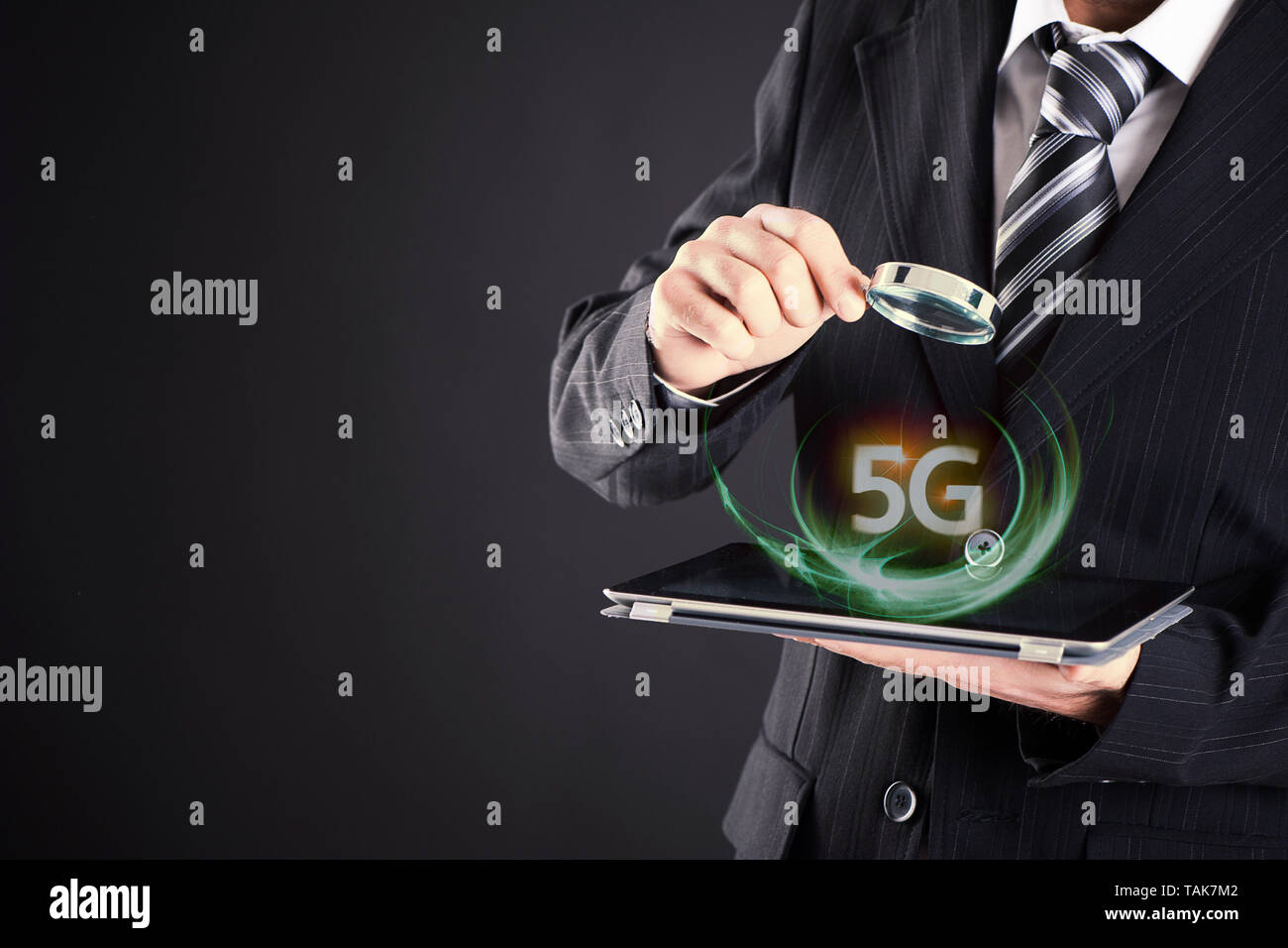 5g tablet on businessman hand connect worldwide. 5G network connection ...