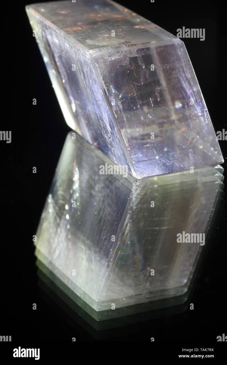 Icelandic Spar Calcite Crystal on a Shiny Black Background. Macro ...