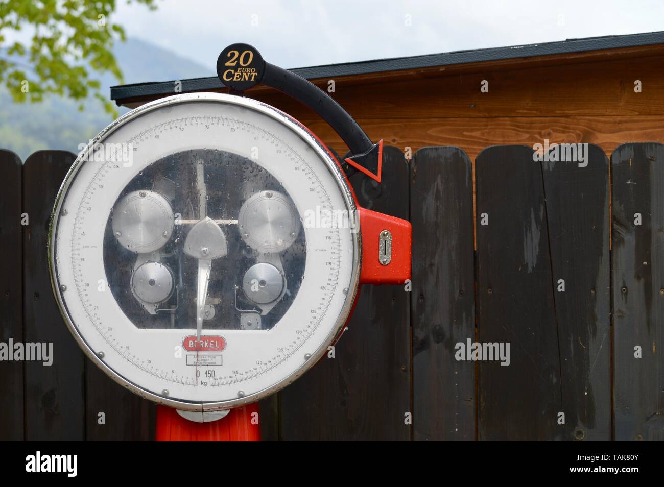 old red scale in an open place usable with coins Stock Photo - Alamy