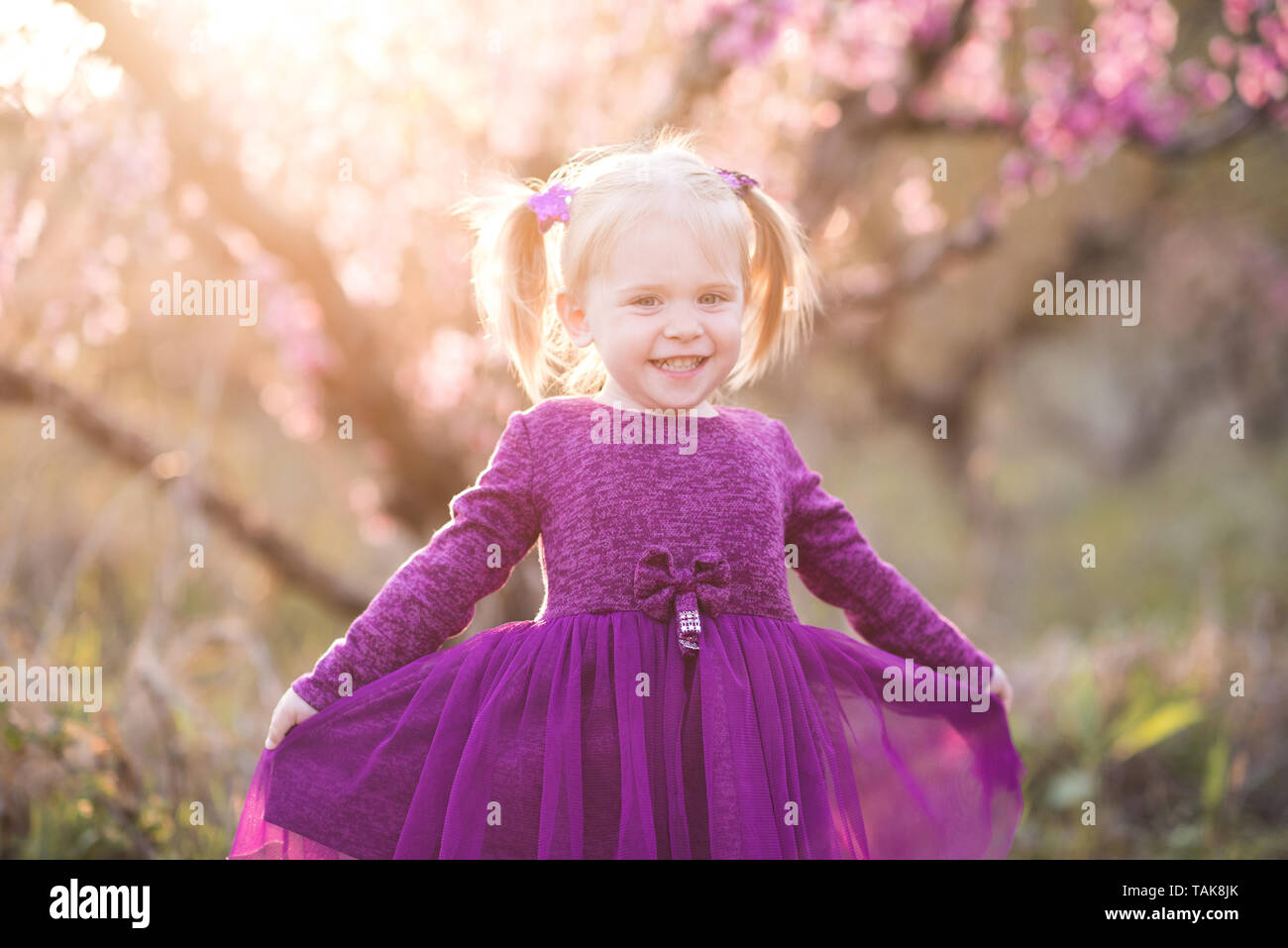 Funny Baby Girl 1 2 Year Old Having Fun Over Nature Background Outdoors funny-baby-girl-1-2-year-old-having-fun-over-nature-background-outdoors