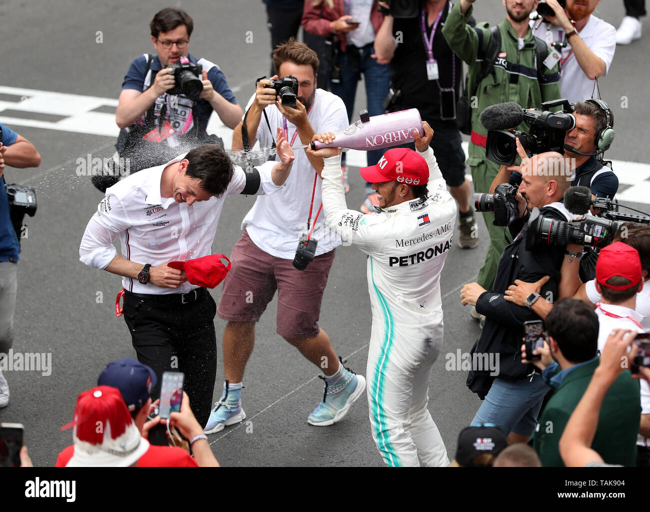 Mercedes' Lewis Hamilton celebrates victory with team principle Toto ...