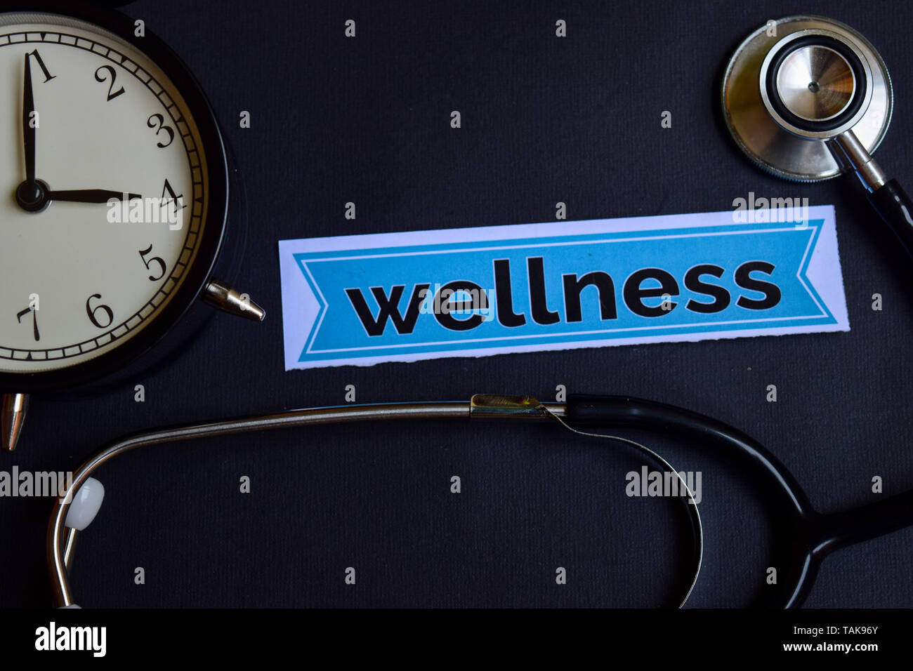 Wellness on the print paper with Healthcare Concept Inspiration. alarm ...