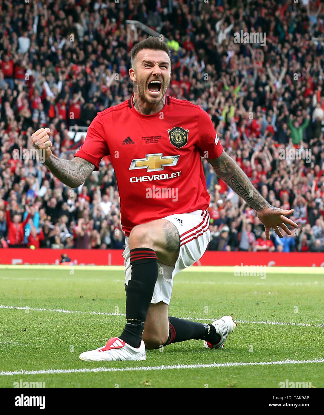 Manchester United Legends David Beckham celebrates scoring his side's ...