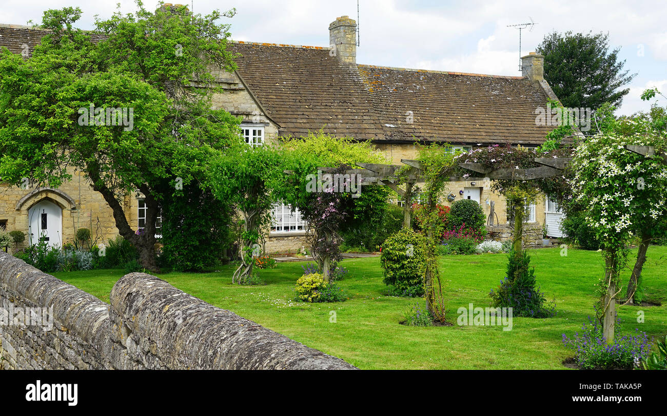 Over the garden wall at Barnack Stock Photo - Alamy