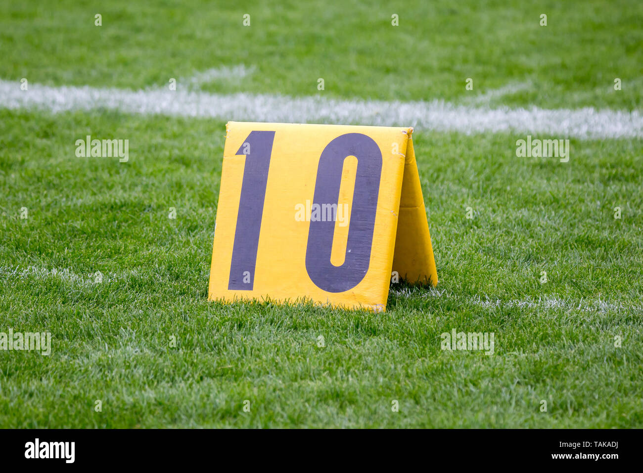 American Football 10 yard marker on grass by the line Stock Photo - Alamy