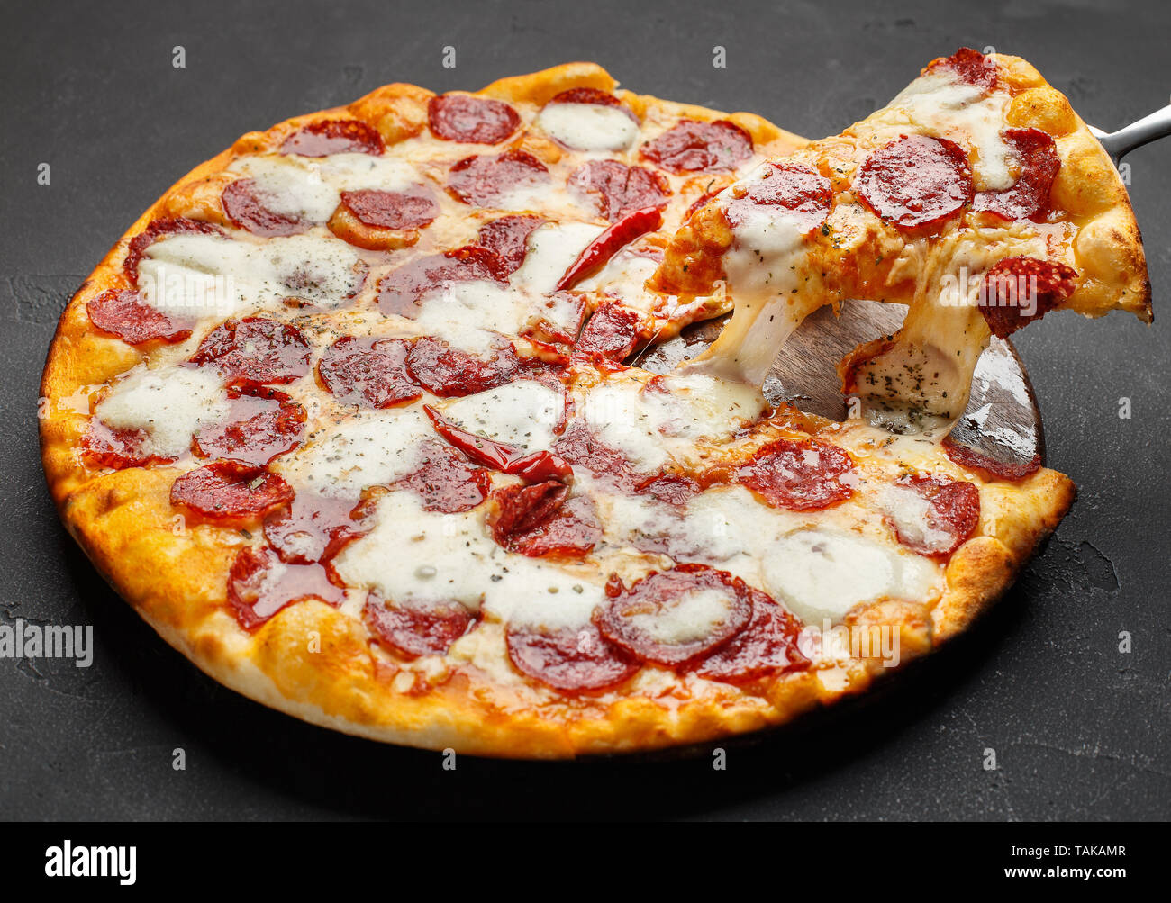 Taking Piece Of Melting Pepperoni Pizza, Closeup Stock Photo - Alamy