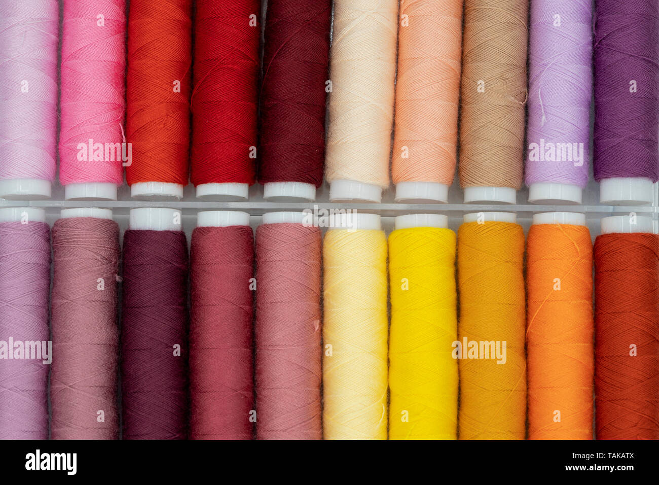 spool of thread many of different colors isolated on white background ...