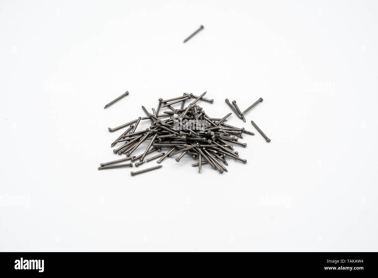 many iron spikes isolated on white lite brite Stock Photo - Alamy