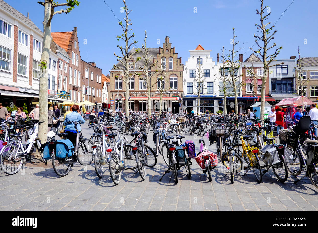 typical Dutch street view in Goes, a market square with lots of parked ...