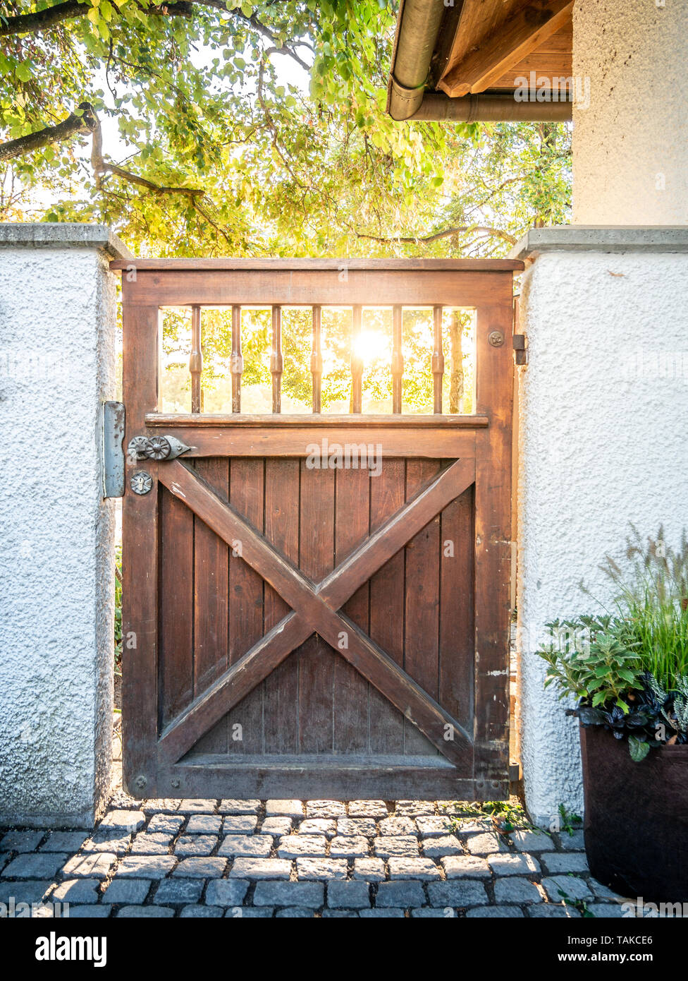 Image of wooden gate with sun rays in the background Stock Photo - Alamy