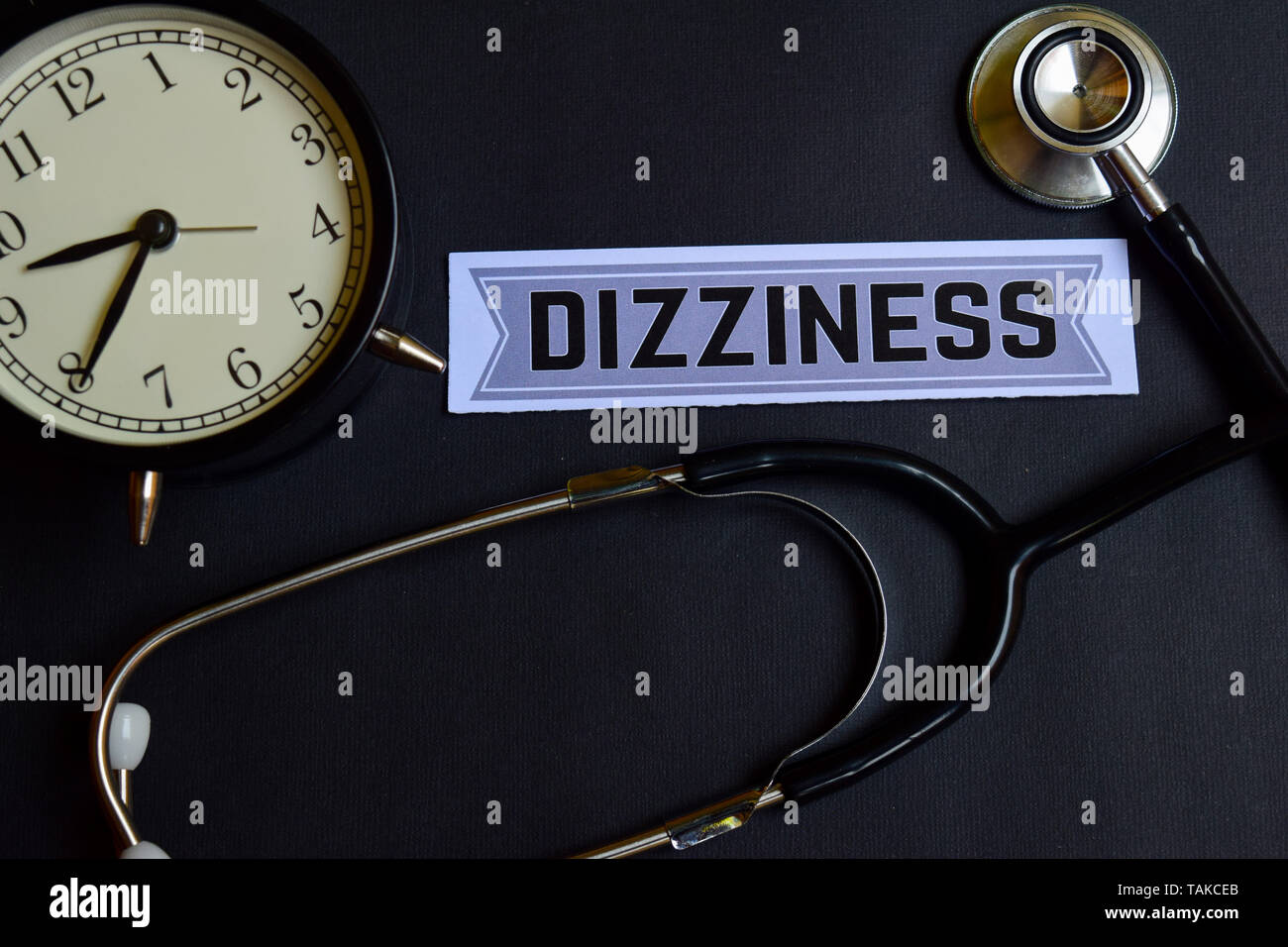 Dizziness on the paper with Healthcare Concept Inspiration. alarm clock ...