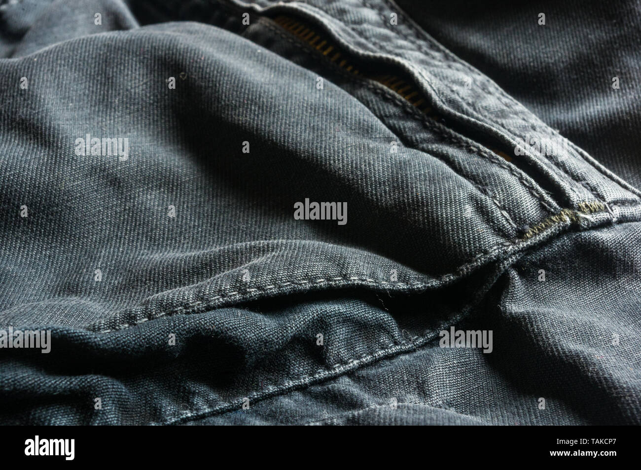 clothing items washed cotton fabric texture with seams, macro, close-up ...