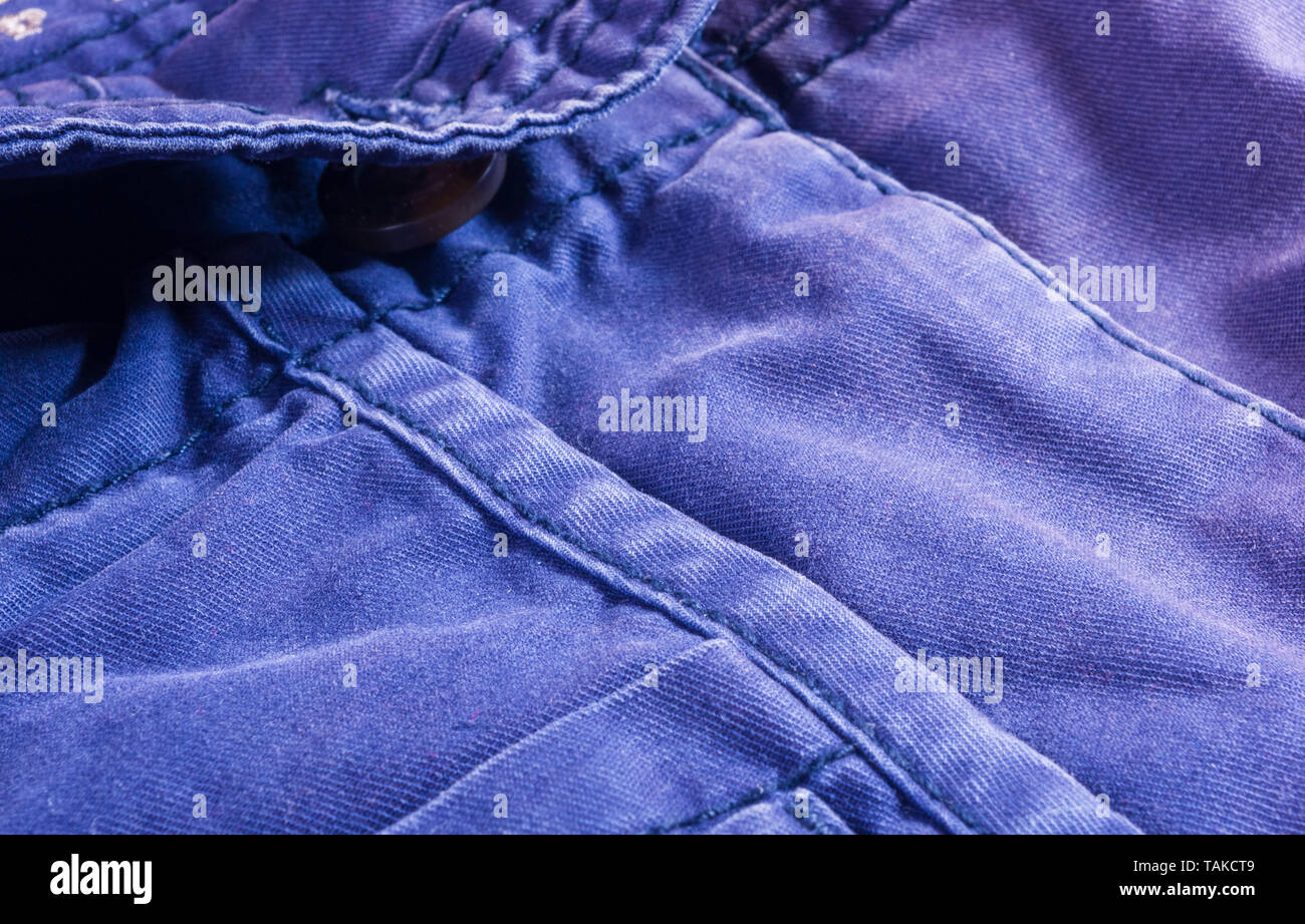 clothing items washed cotton fabric texture with seams, macro, close-up ...