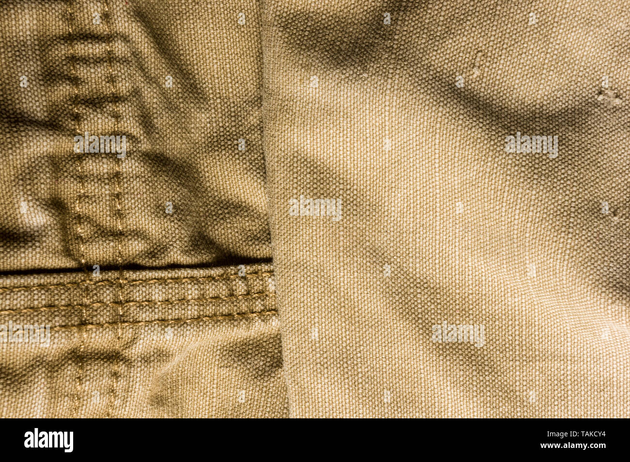 clothing items washed cotton fabric texture with seams, macro, close-up ...