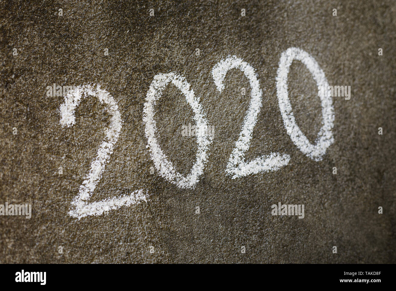 2020 concept. Handwritten with chalk text on grey wall Stock Photo - Alamy