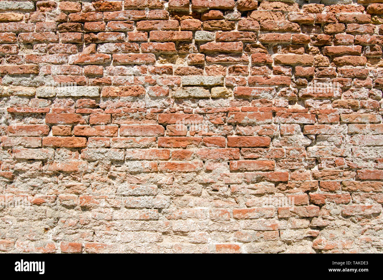 Brick wall with severe weathering and mortar loss on a sunny day in ...