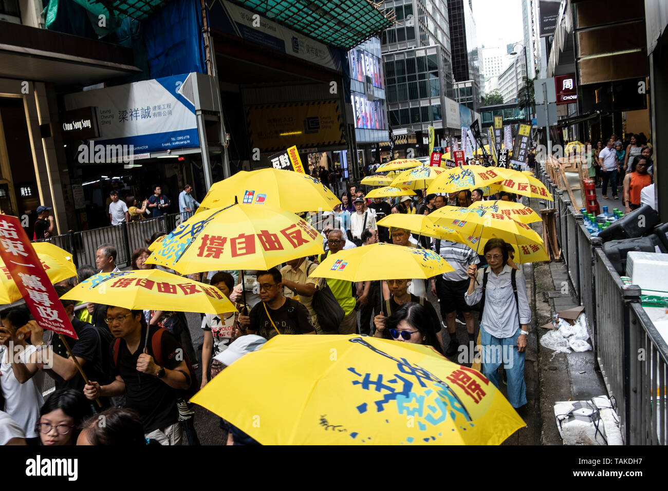 Protesters seen holding yellow umbrellas during the demonstration. Pro ...