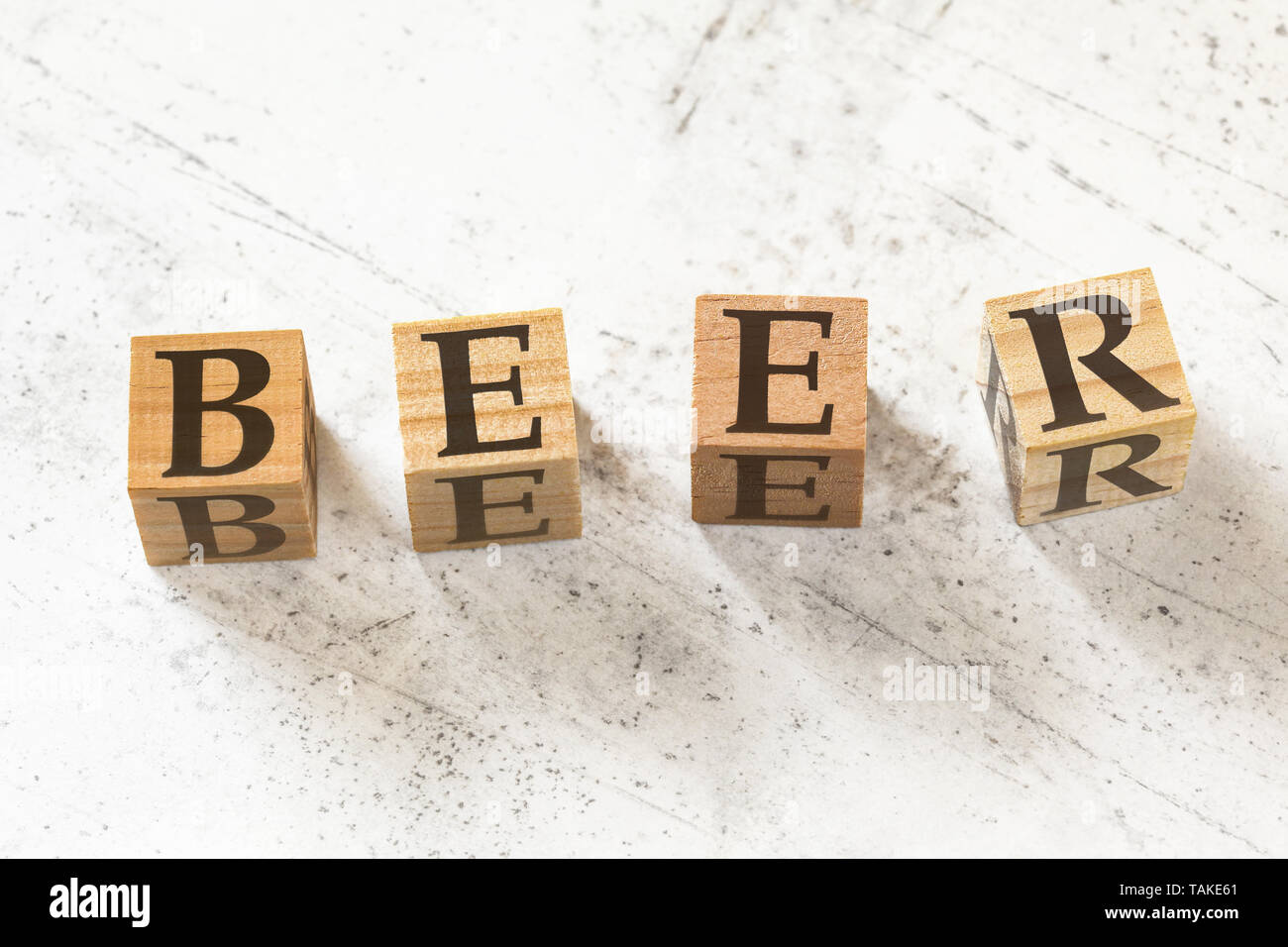 Four wooden cubes with letters BEER meaning BEHAVIOUR EFFECT ...