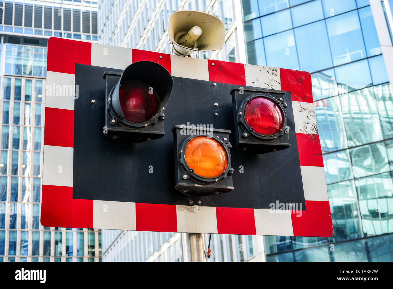 Board with red and white squares, orange traffic lights and speaker ...