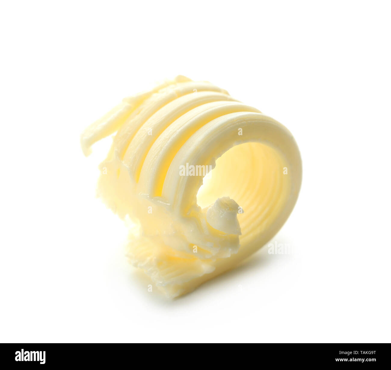 Butter curl on white background Stock Photo - Alamy