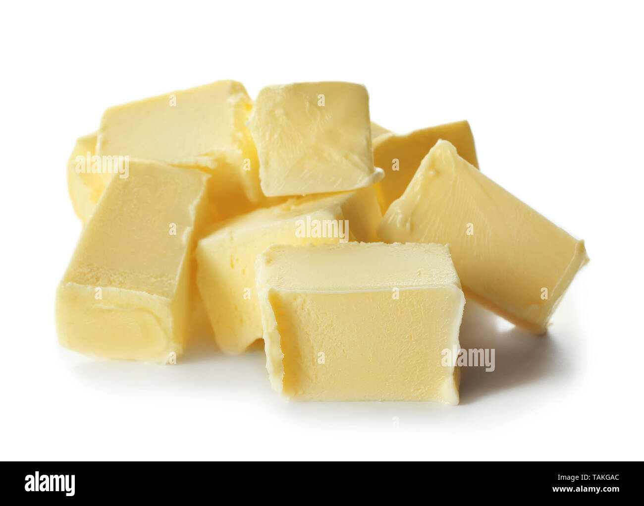 Pieces of butter on white background Stock Photo - Alamy